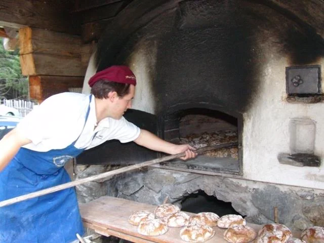 Traditional Baking of bread in an old stone oven S.Stefano Stefansdorf Activities and Events in South Tyrol